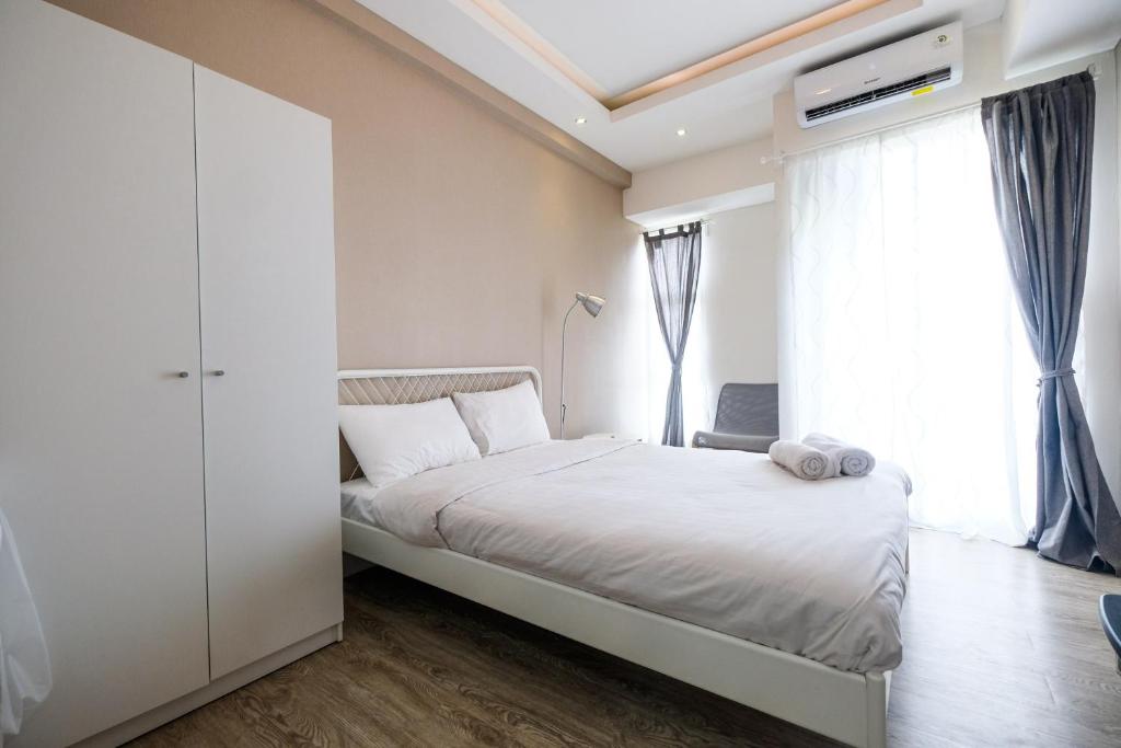 Modern Studio Akasa Pure Living BSD Apartment By Travelio, Ciater-hilir ...