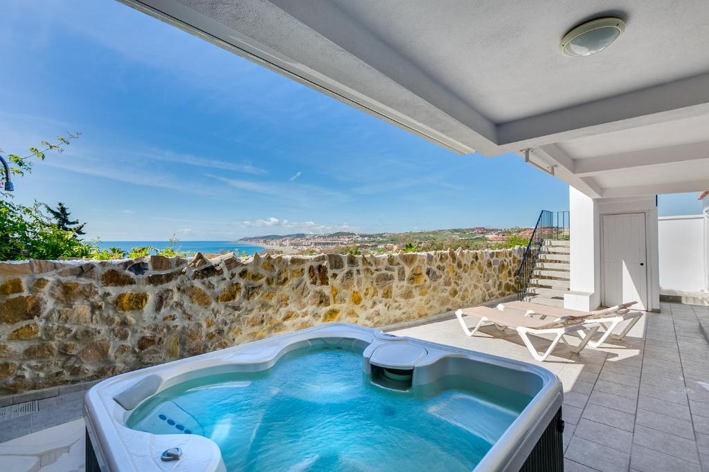 Modern villa with sea & beach views, jacuzzi, BBQ Walk to beach ...