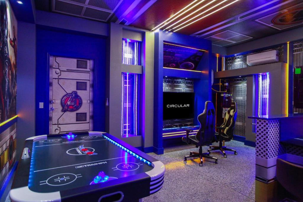 Modern villa with an arcade, theater, pool and spa that the family will ...