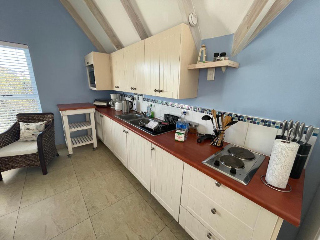 De Blauwvoet - Dolfyn (Sunset Beach), Kaapstad – Bijgewerkte prijzen 2024