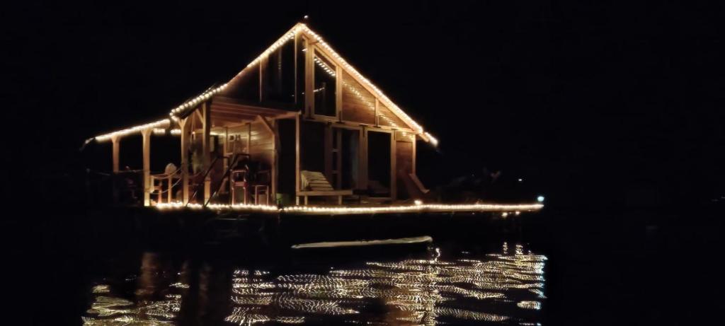 House On Lake At Night