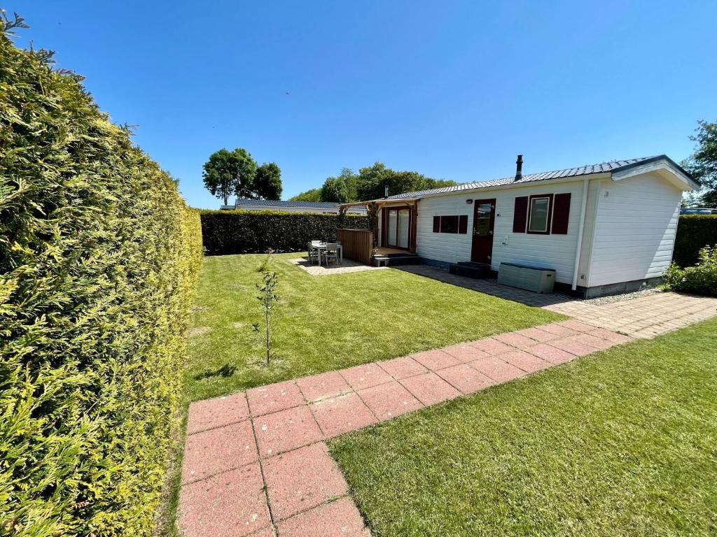 Attractive chalet with enclosed garden near sea, Tzummarum (updated ...