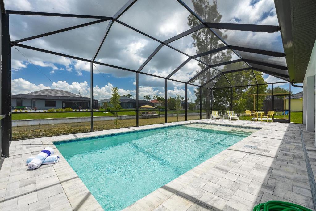 Pool overlooking canal, Outdoor Grilling station - Villa Sand Dollar ...