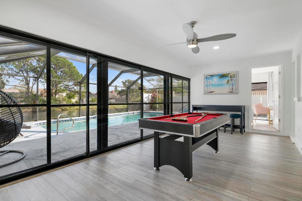 Tropical Tranquility! Luxury pool home with lakefront view just minutes ...
