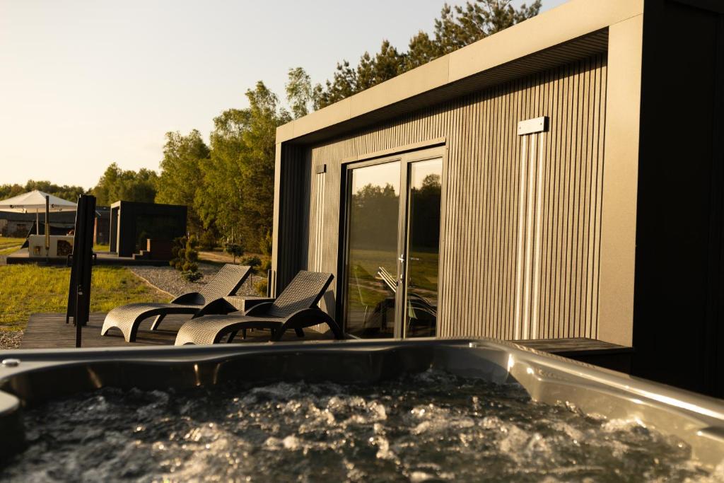 Uroczy mały domek z jacuzzi, Długosiodło (aktualisierte Preise für 2026)