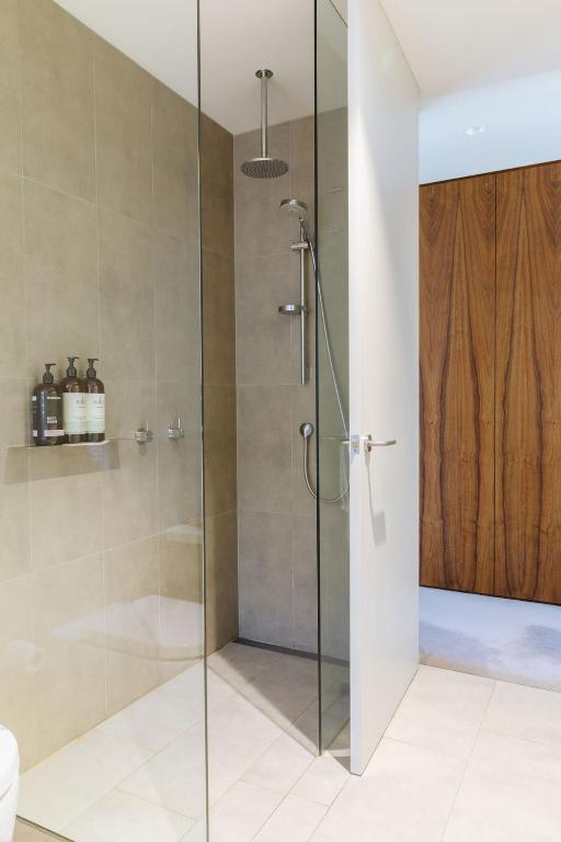 Architectural glass house with ocean views, Taroona (updated prices 2025)