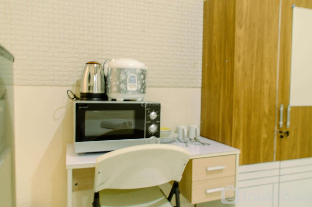 Comfy Studio Apartment at Aeropolis Residence near Soetta By Travelio ...