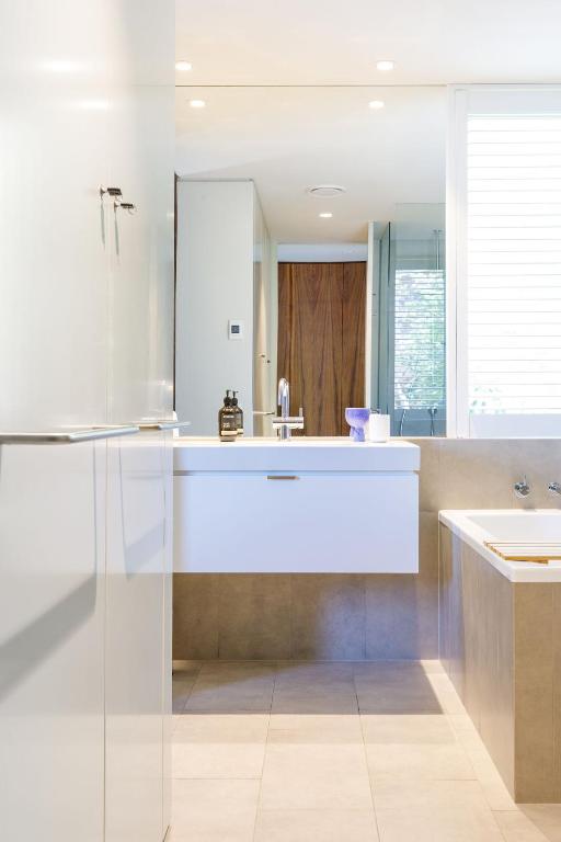 Architectural glass house with ocean views, Taroona (updated prices 2025)