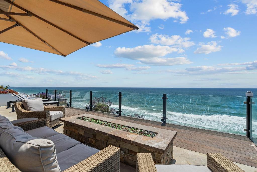 Neptune Sunset Shores Oceanfront home with expansive outdoor living ...