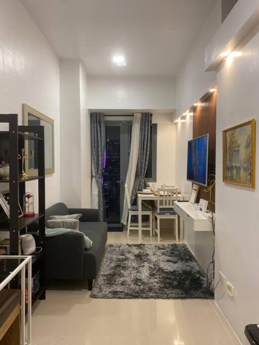 1BR CONDO Fame Residences Mandaluyong- Be My Guest Staycation- Near SM ...