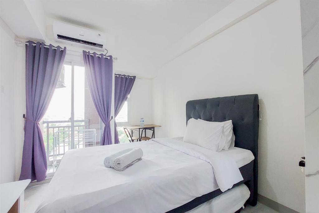 Minimalist and Homey Studio Akasa Pure Living BSD Apartment By Travelio ...