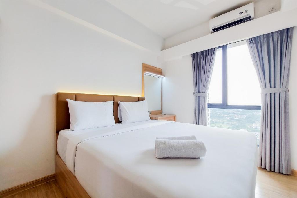 Warm and Comfort Stay 2BR at Sky House BSD Apartment By Travelio ...