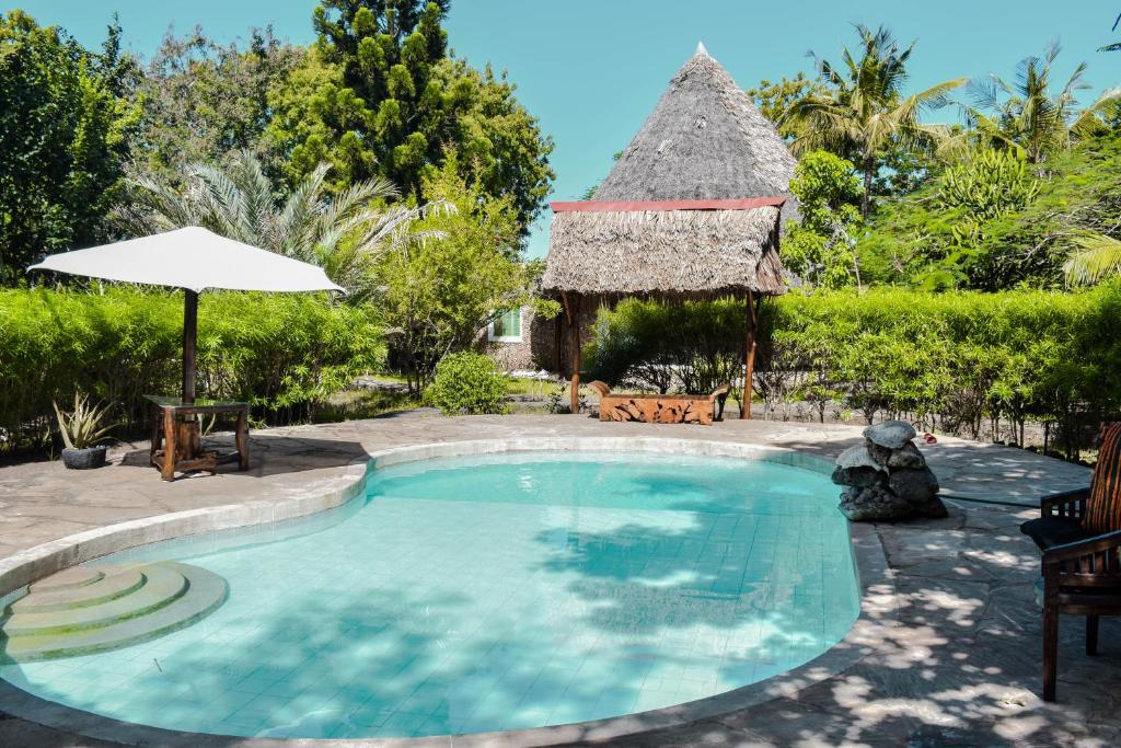 African hut tiny cottage, Diani Beach (preços atualizados para 2024)