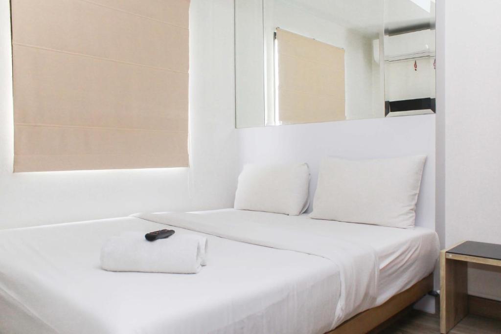 Homey and Simply 2BR at Lagoon Bekasi Town Square Apartment By Travelio ...