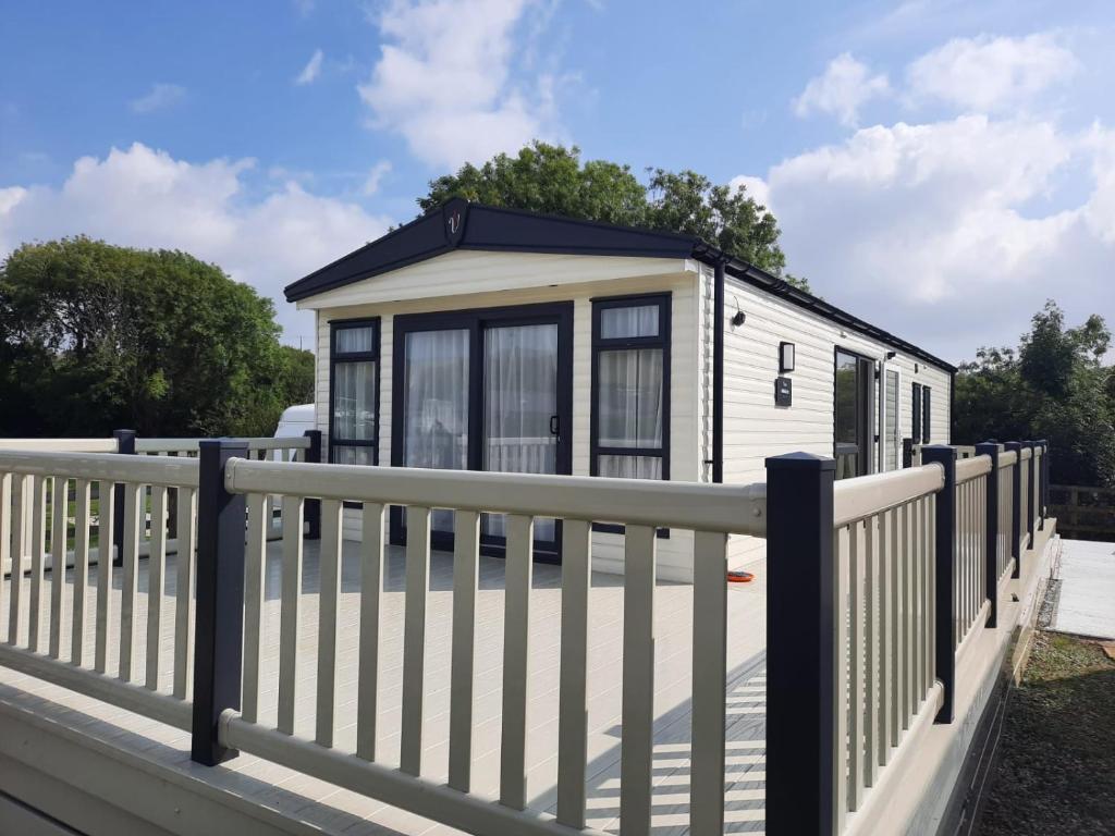 Sunset retreat caravan with large wrap around decking, Newquay (updated ...