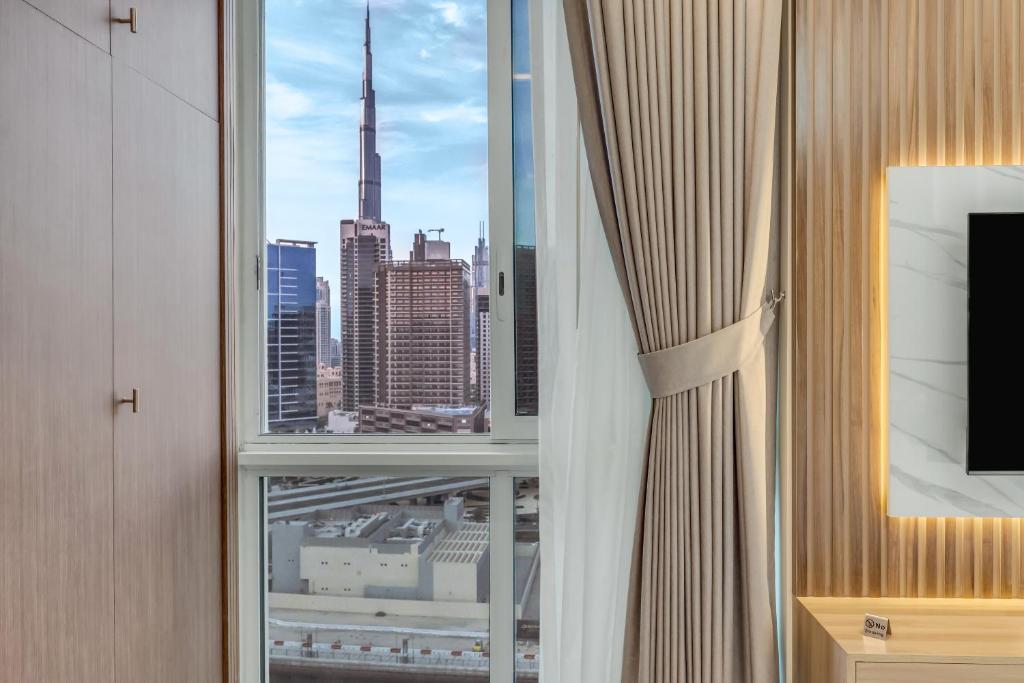 The NEW prestige- Posh 1BDR with Burj Khalifa View - Mayfair Tower in ...