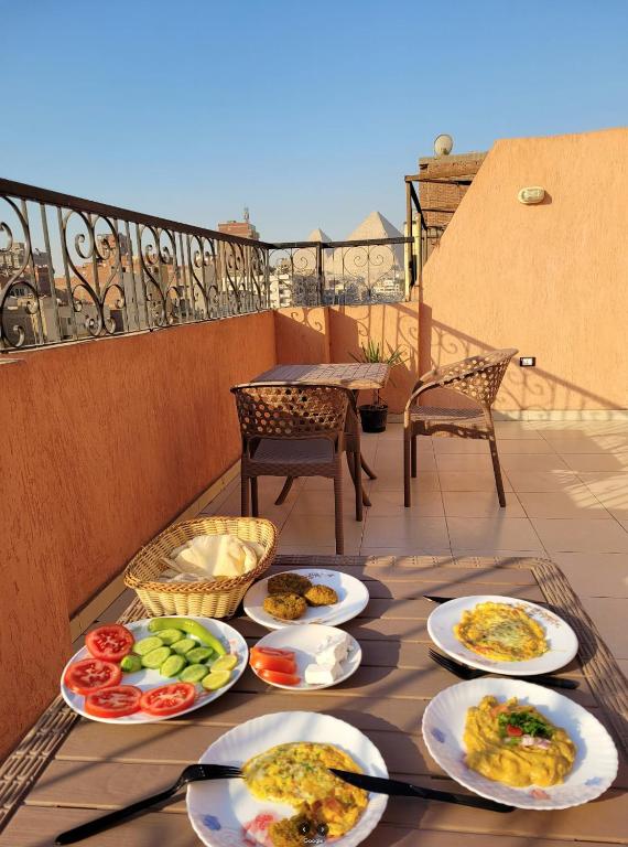 Pyramids Road Guest House cozy rooms and rooftop breakfast with the ...