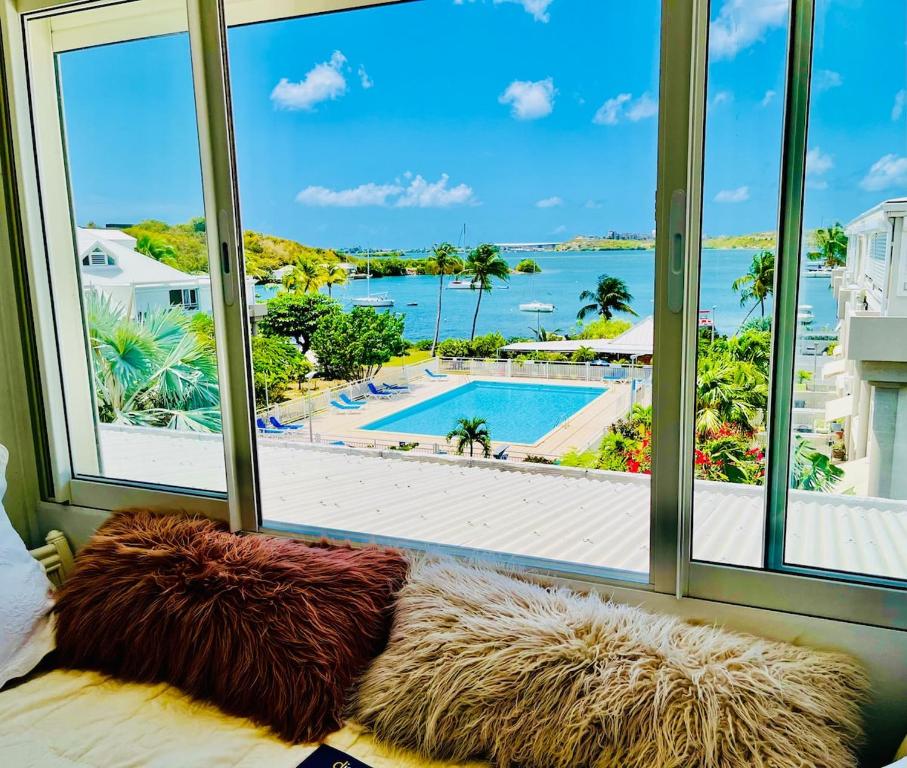 Cozy Waterfront Two-Level Condo with 2 Bathrooms ,Pool, AC, Baie Nettle ...