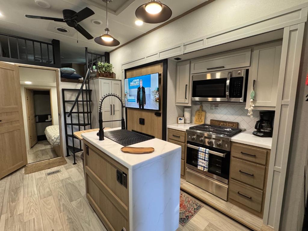 Spacious Four room glamping Rv with Tiki bar including golf cart, River ...