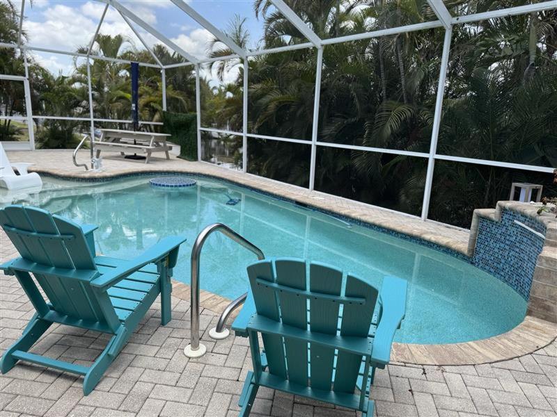 Heated Pool & Tiki Hut on a Stunning Canal View - The Dancing Dolphin ...