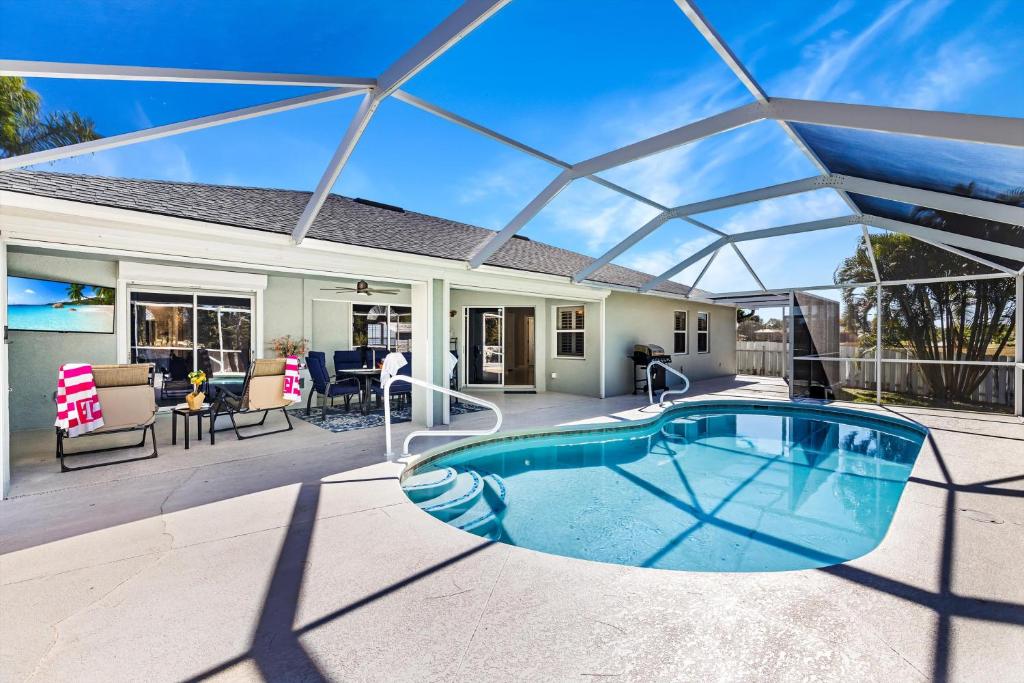 Great outdoor living area! Electric-heated pool & fully fenced yard ...