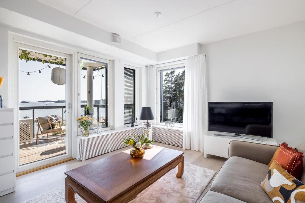 1-Bedroom Beachfront Apartment with Balcony, Sauna and Parking in ...