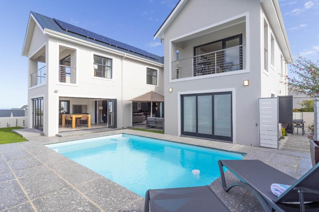 Relax in comfort and style with a swimming pool, aircons and braai room ...