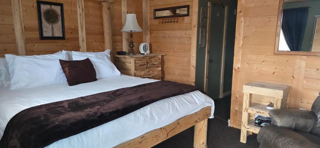 Suite with a King Bed and Full Kitchen at the Cedaredge Lodge ...