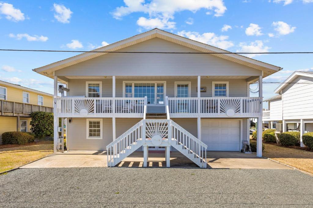 Canal front home with a floating dock and large deck with sound views ...
