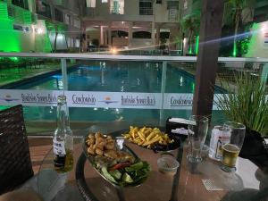 Apto em Bombas com jacuzzi privado, piscinas, gym completo, sauna ...