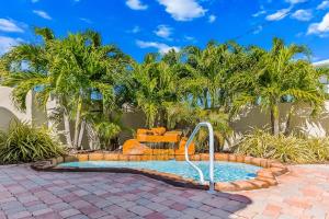 Custom canal-front home with private pool, palapa hut, & outdoor ...