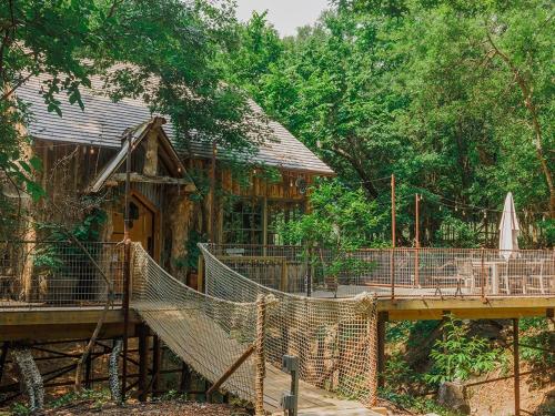 Hobbit Treehouse with waterfall on the Brazos River! 350 acres! Tubing ...