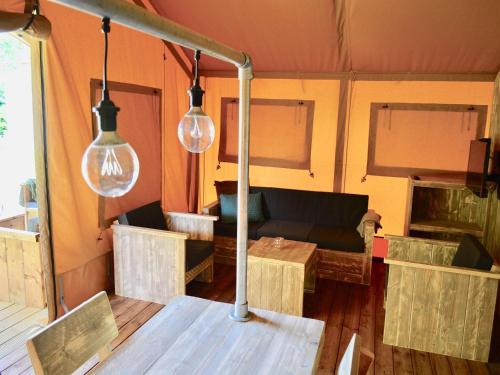 Luxury tent with kitchen and shower, in a holiday park by the sea and ...