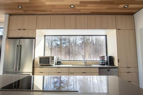 Luxury Lakefront Container Home with Sauna, Fishing, Mountain Views ...