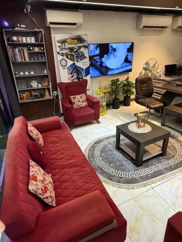 A house with an office that has a living room and an office room ...