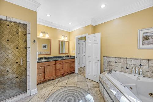 Lakefront home with private hot tub, WiFi, fun rec room, & beach area ...